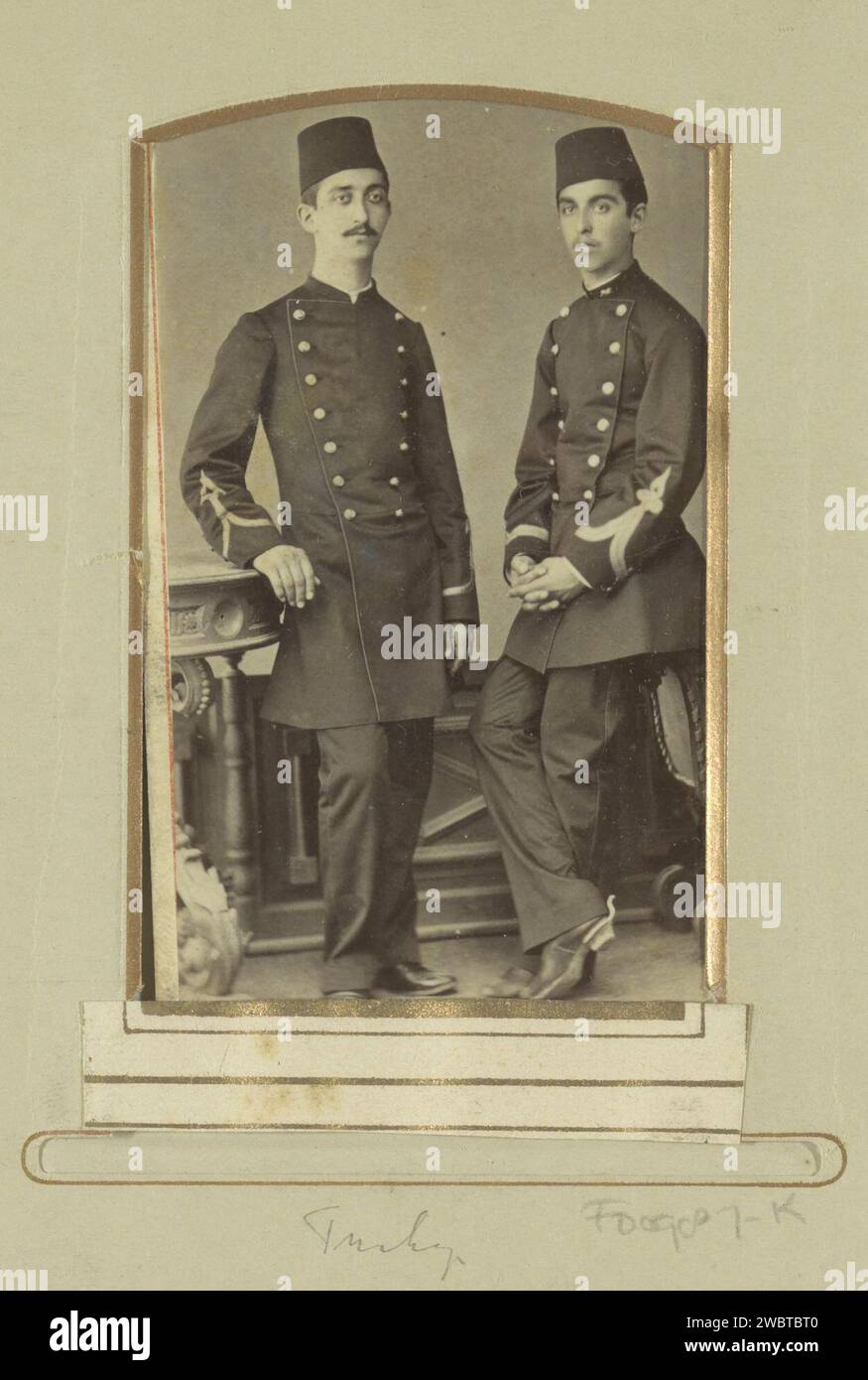 Portrait of two (presumably) Turkish soldiers, standing at a table with ...