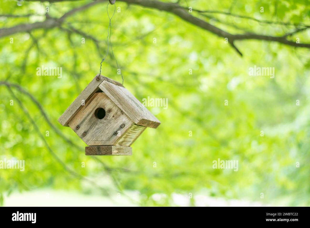 Hanging wooden birdhouse hi-res stock photography and images - Alamy