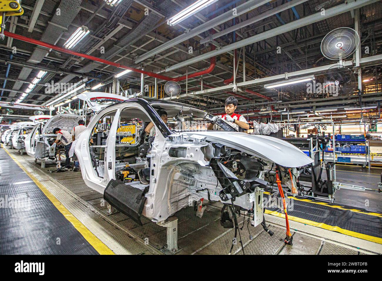 Rayong, Thailand. 12th Jan, 2024. Workers work at the Great Wall Motors ...