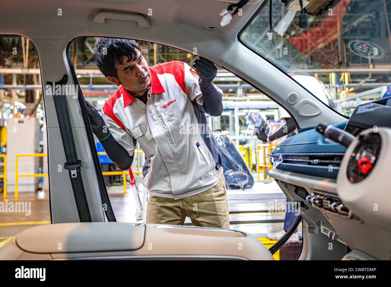 Rayong, Thailand. 12th Jan, 2024. A worker works at the Great Wall ...