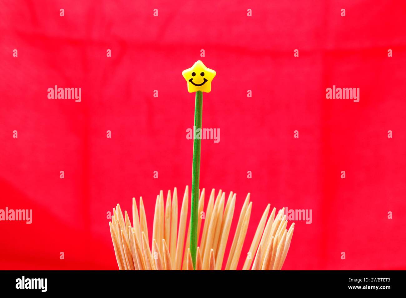 Group of wooden sticks where one stands out Stock Photo - Alamy