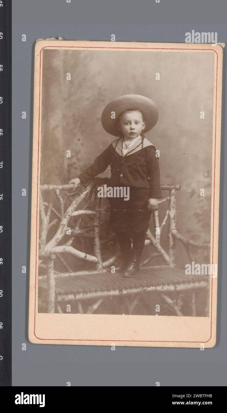 Portrait of an unknown boy with a hat standing on a bank, Christiaan ...