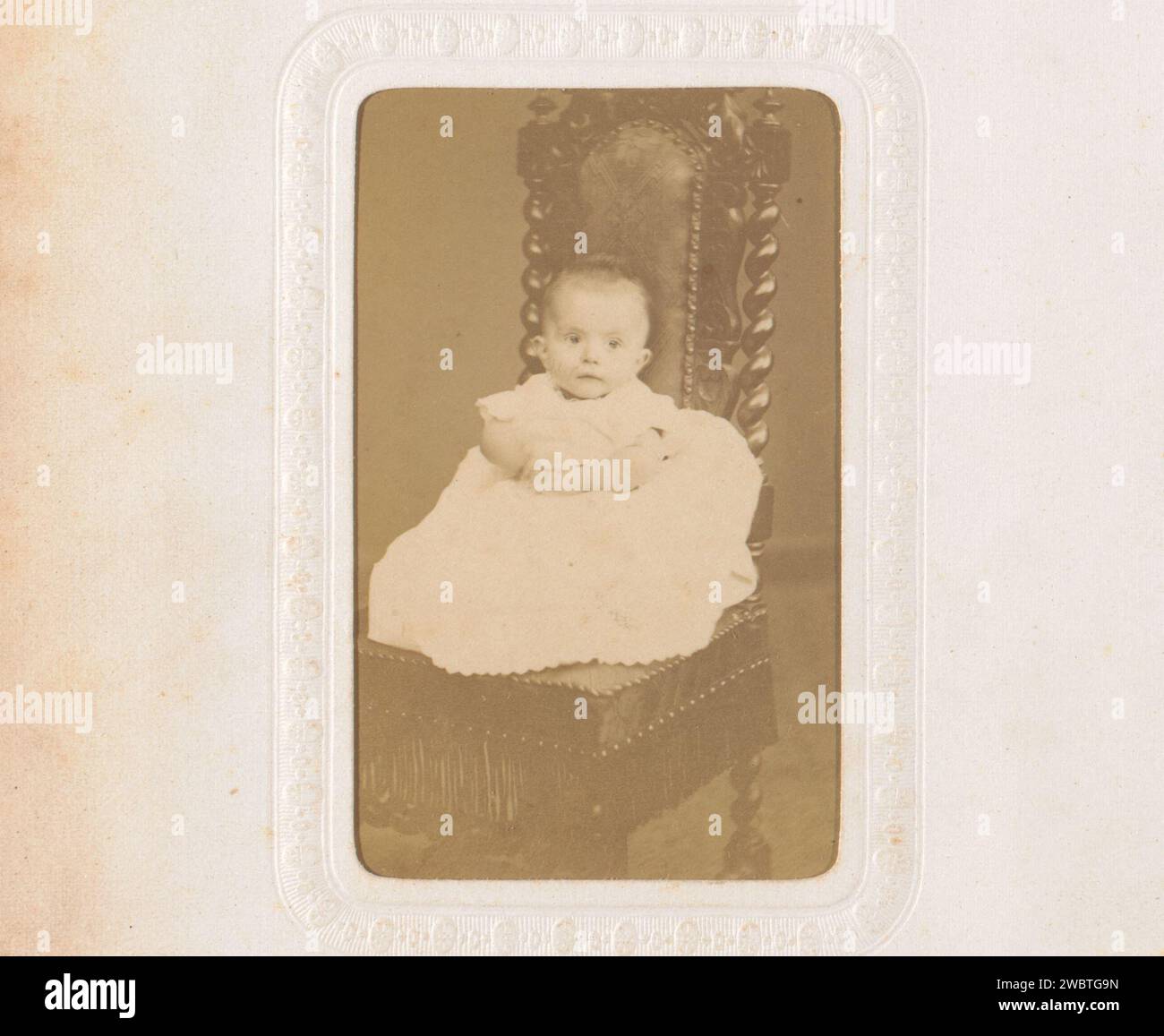 Portrait of a baby in baptismal dress, sitting on a chair, Anonymous ...