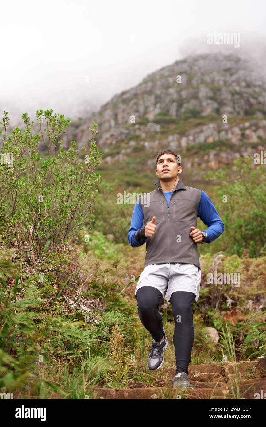 Steps, athlete and man running in nature training, cardio exercise and ...