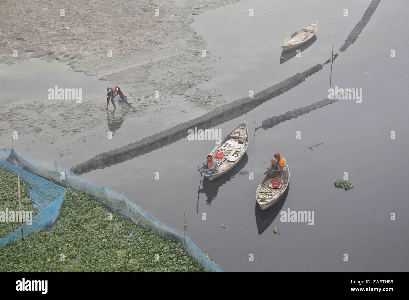 Manikganj, Bangladesh - January 01, 2024: The fishermen fishing in the ...