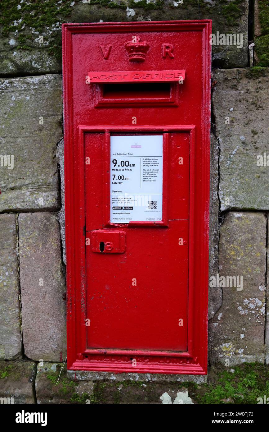 A post box mounted in a stone wall at Studley Castle, Warwickshire ...