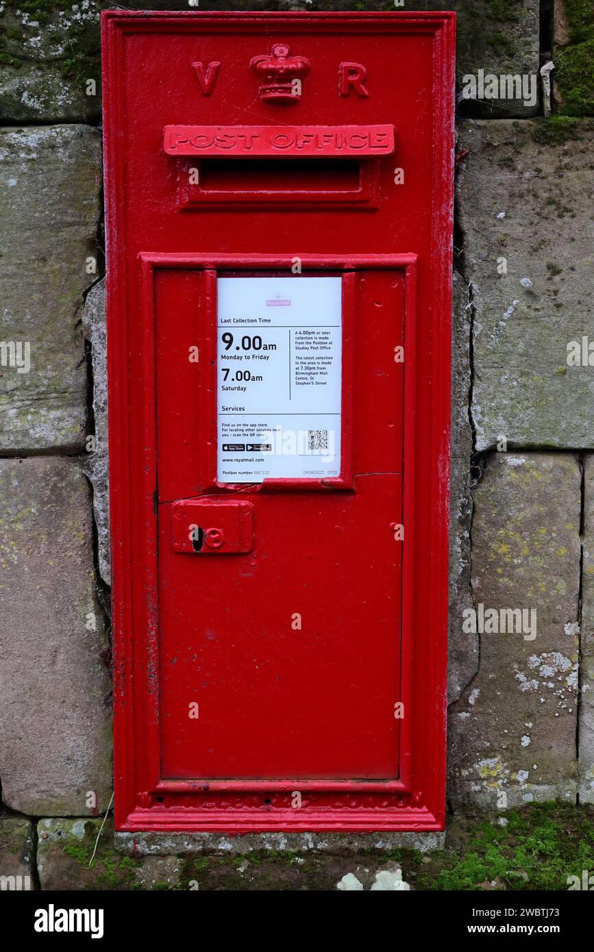 A post box mounted in a stone wall at Studley Castle, Warwickshire ...