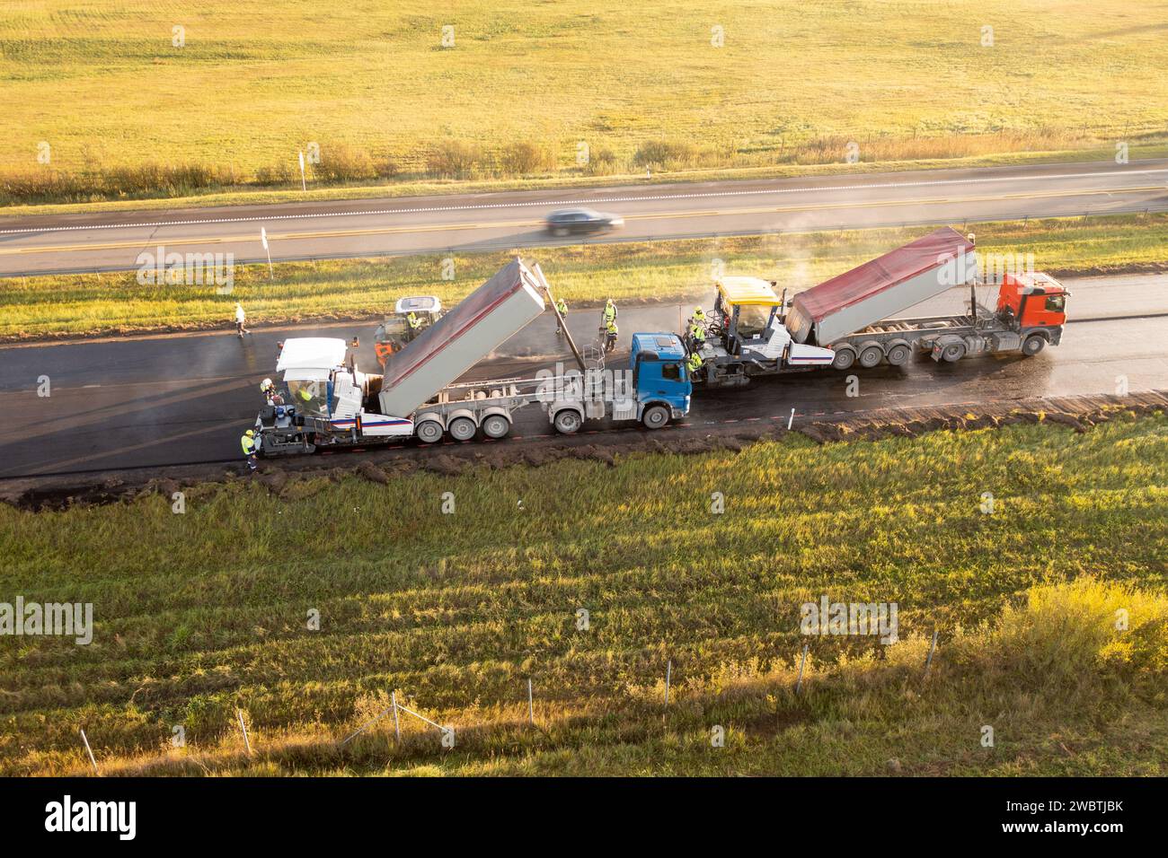 Drone photography of highway repair with heavy industrial machinery ...