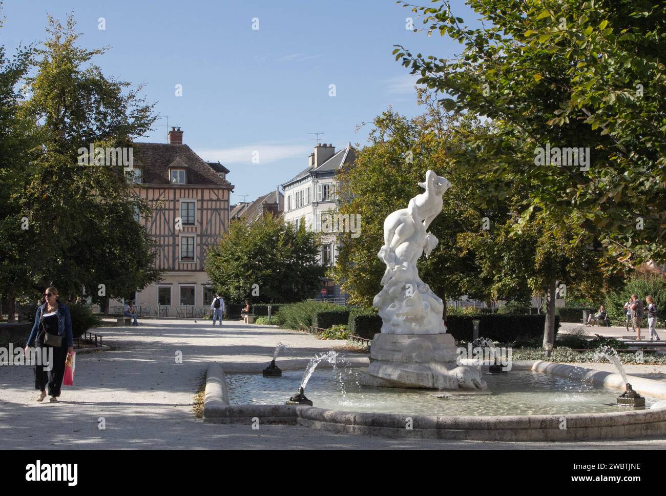 A woman walks past Le Rapt (Abduction), a marble statue made in 1907 by ...