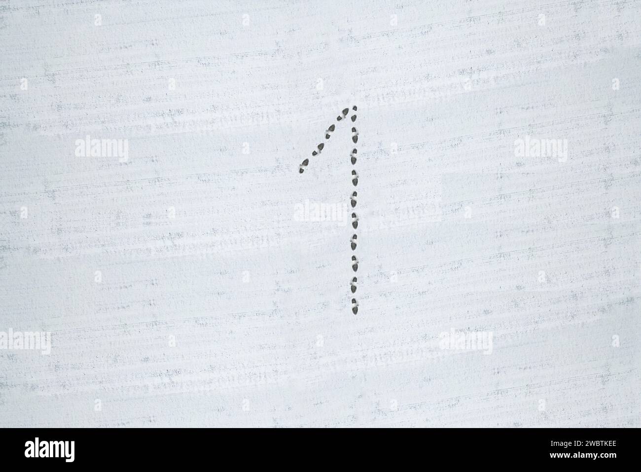 A number 1 written in the snow. Winter writings Stock Photo - Alamy