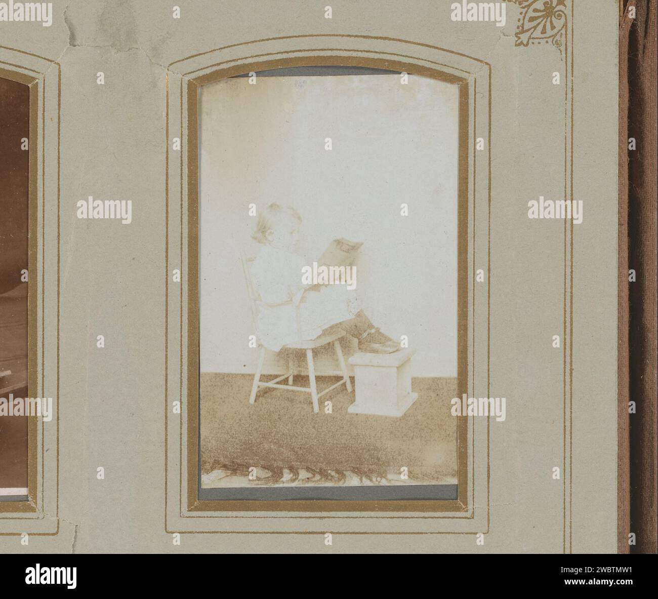 Portrait of a girl on a chair, with her feet on a stew, Anonymous, 1882 ...