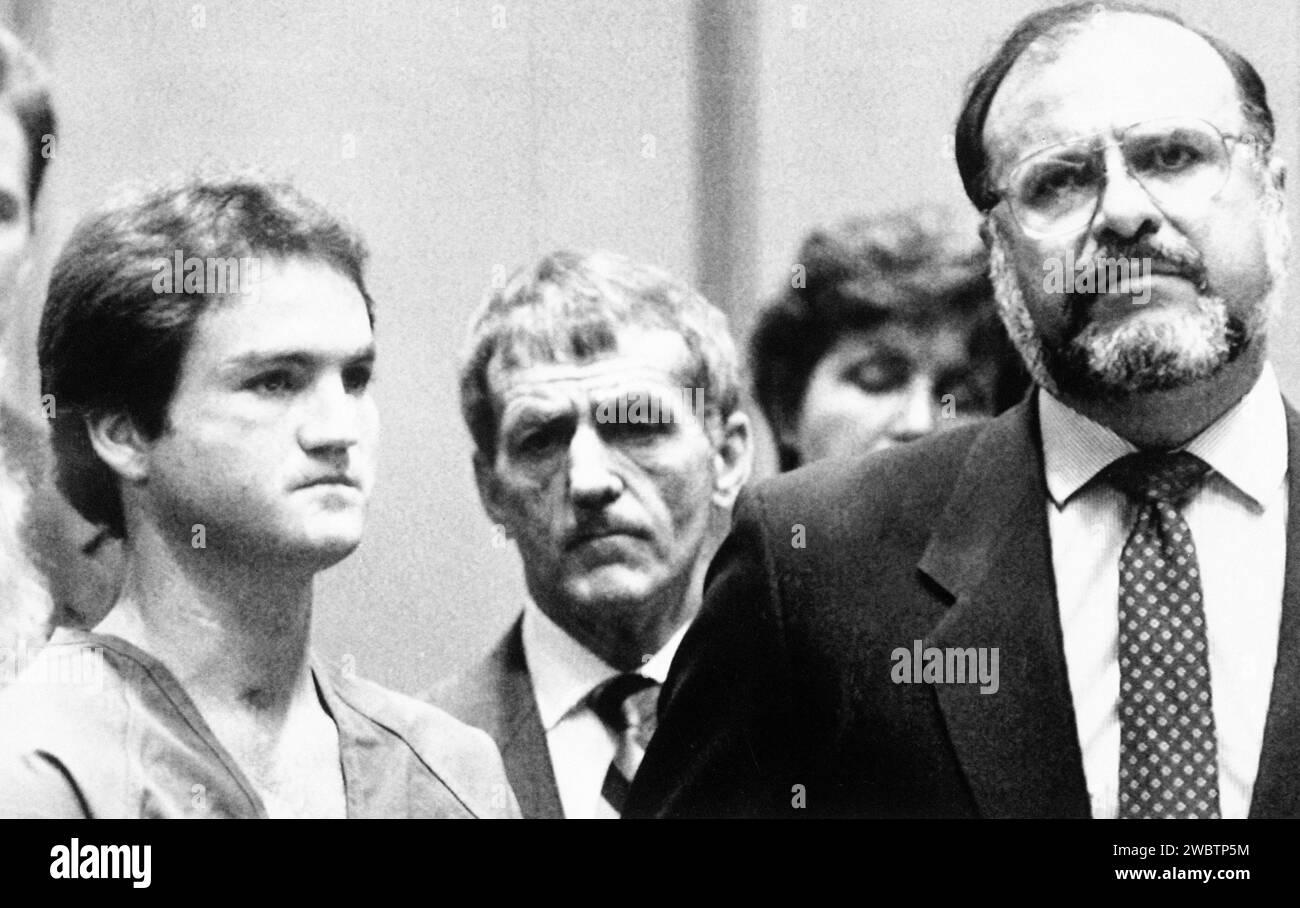 Olympic diver Bruce Kimball, dressed in prison blues, stands stone ...