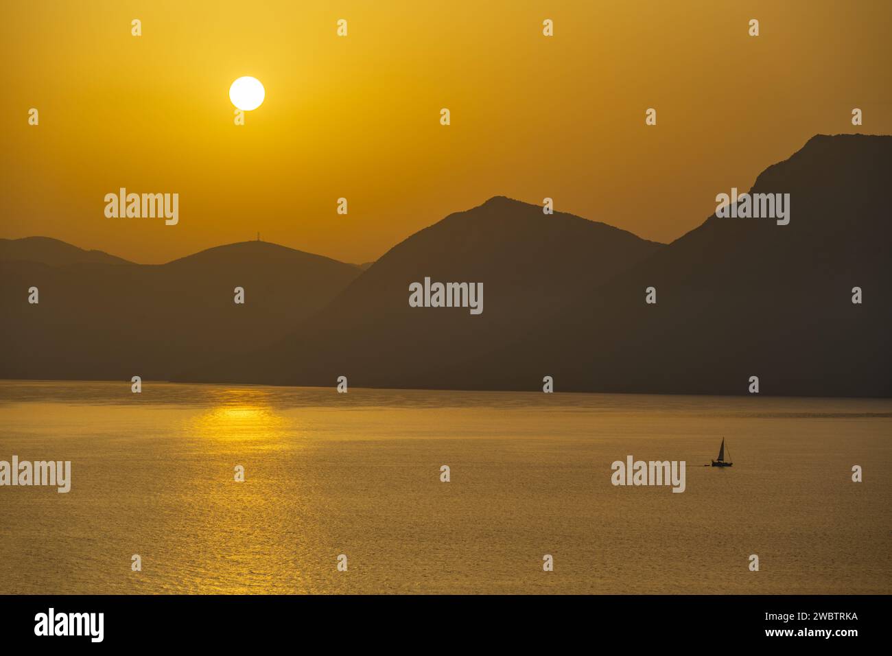 Dawn breaking behind the mountains of Mainland Greece from the Island ...