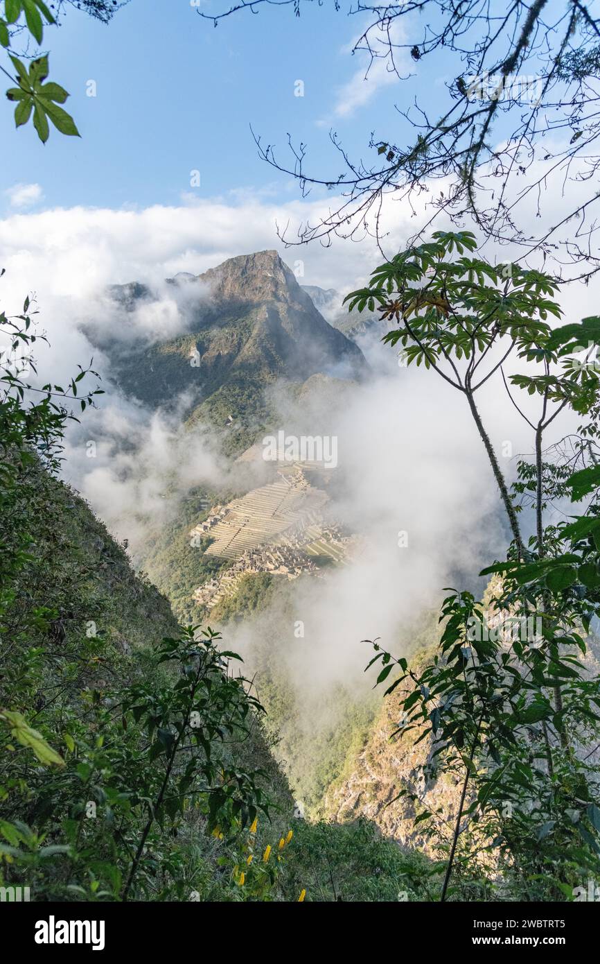 A cloudy and misty view of the Machu Picchu citadel ruins from Huayna ...