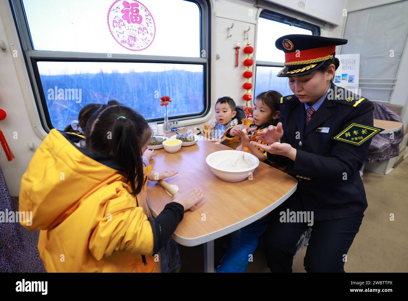 (240112) -- HARBIN, Jan. 12, 2024 (Xinhua) -- Chief conductor Zhao Zihe ...