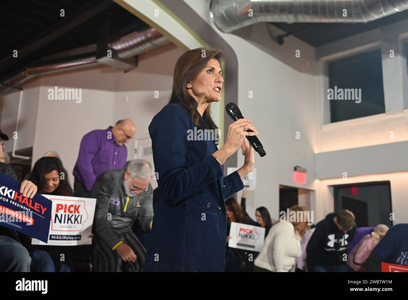 Nikki Haley enters the event space to start the countdown to caucus ...