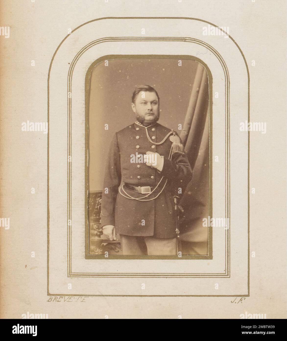 Portrait of a standing man in uniform with sword, Albert Delabarre ...