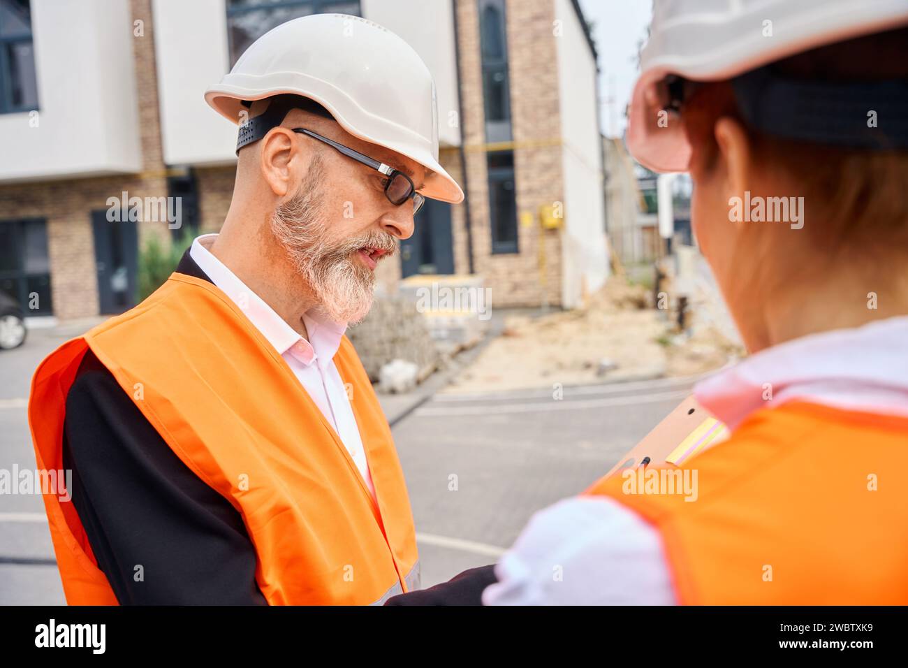 Staff scrutinizing hi-res stock photography and images - Alamy