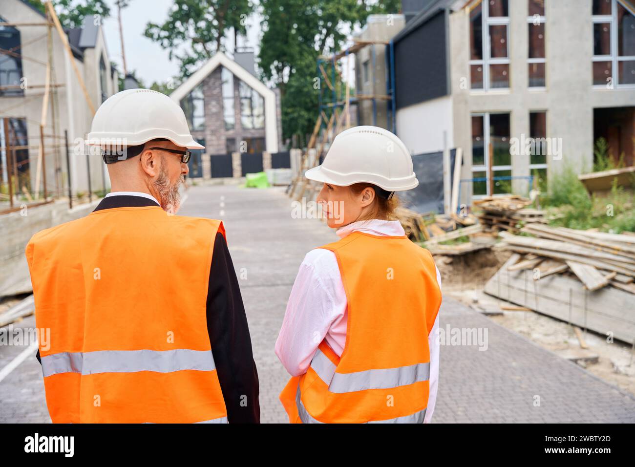 Construction supervisor communicating with foreman during site ...