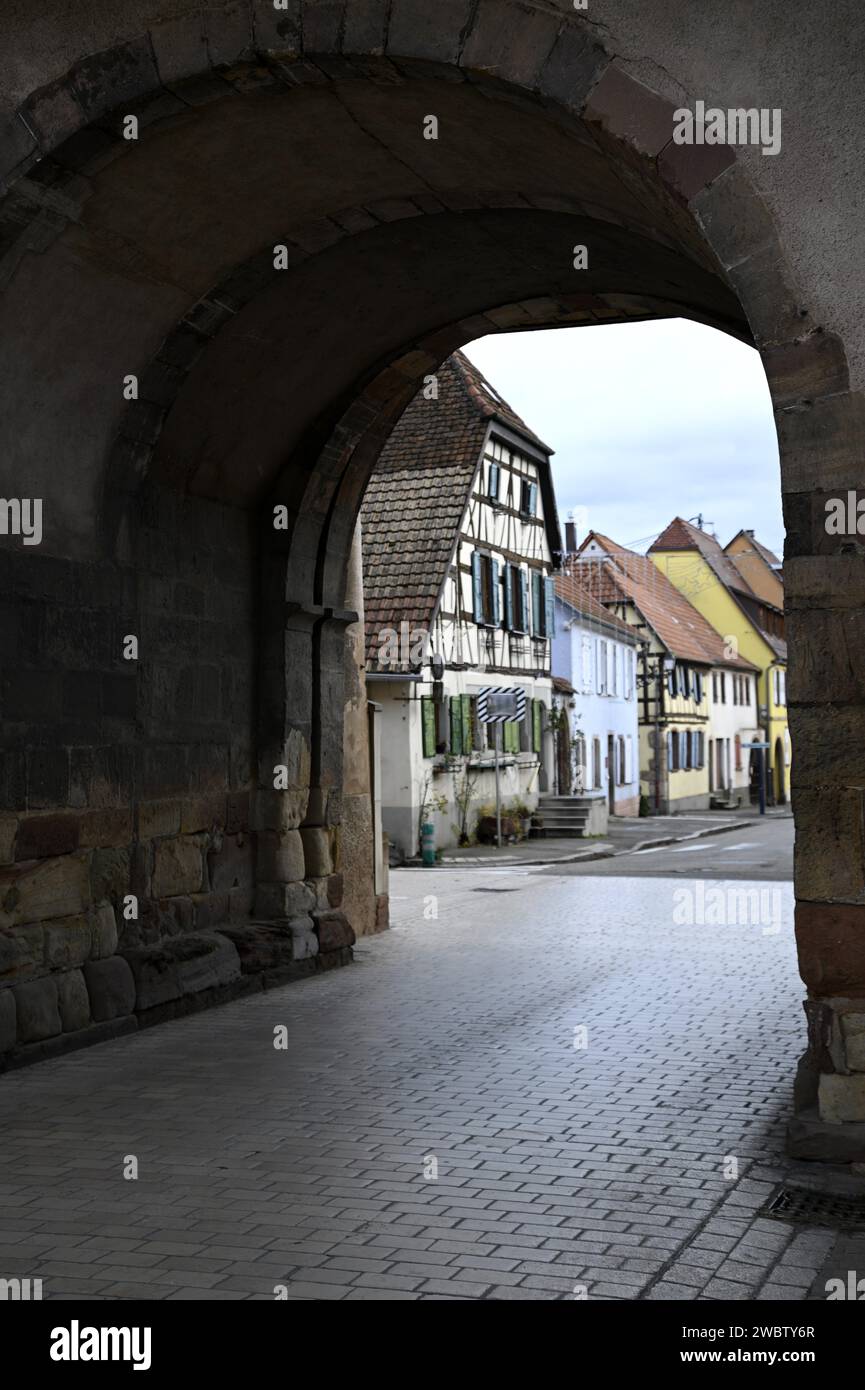 Landscape with scenic view of Rosheim as seen through the arched gate ...
