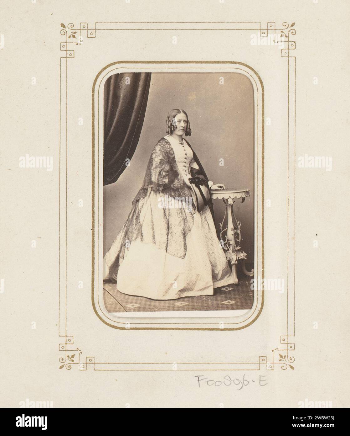 Portrait of a woman standing at a table, William Elliot Debenham, 1860 ...