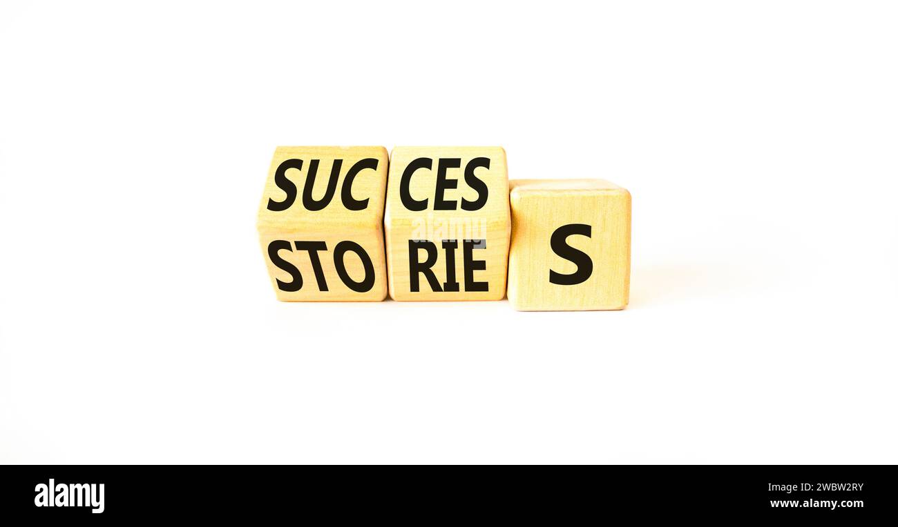 Success stories symbol. Turned wooden cubes and changed the word ...