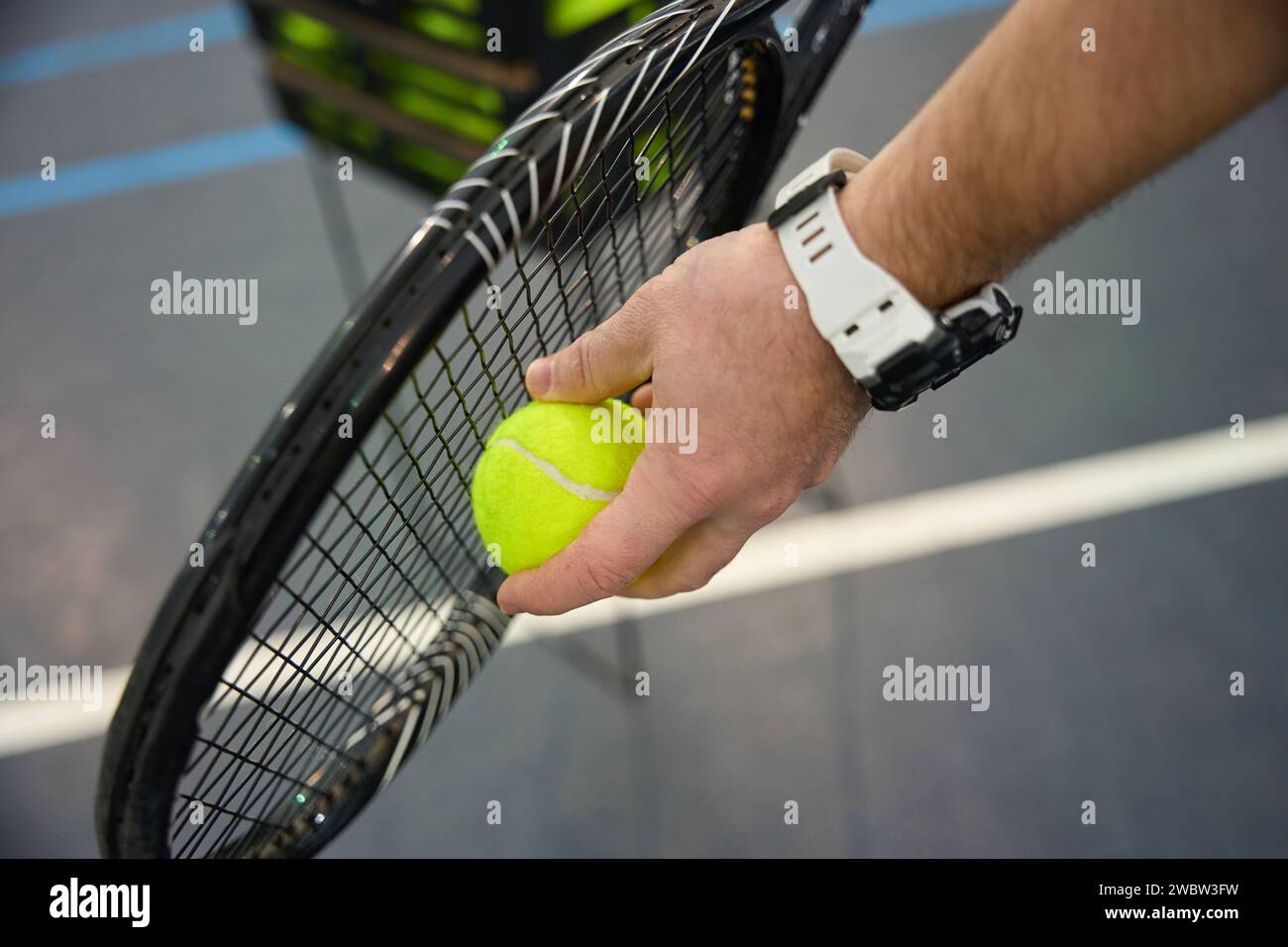 Closeup of male hand holding tennis ball and racket tennis player ...