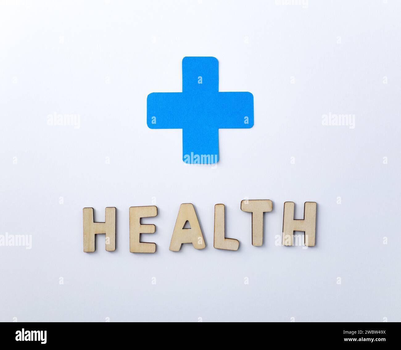 Background with cutouts of wooden letters forming the word health and ...