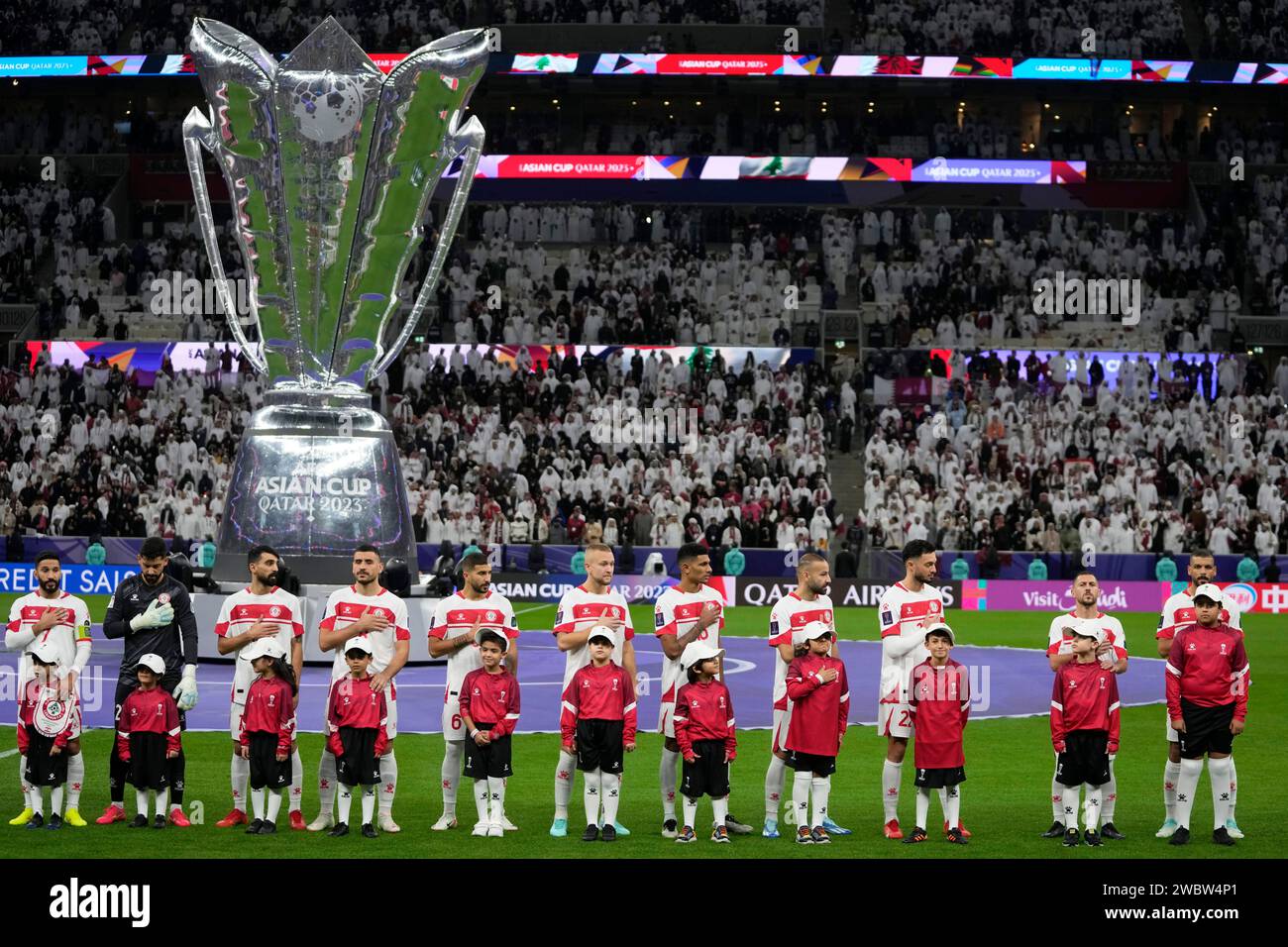 Lebanon players stand during the national anthems before the Asian Cup ...