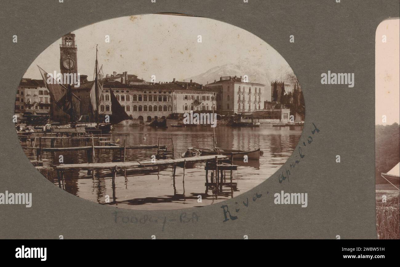 View of the port of Riva del Garda with bell tower, buildings and ...