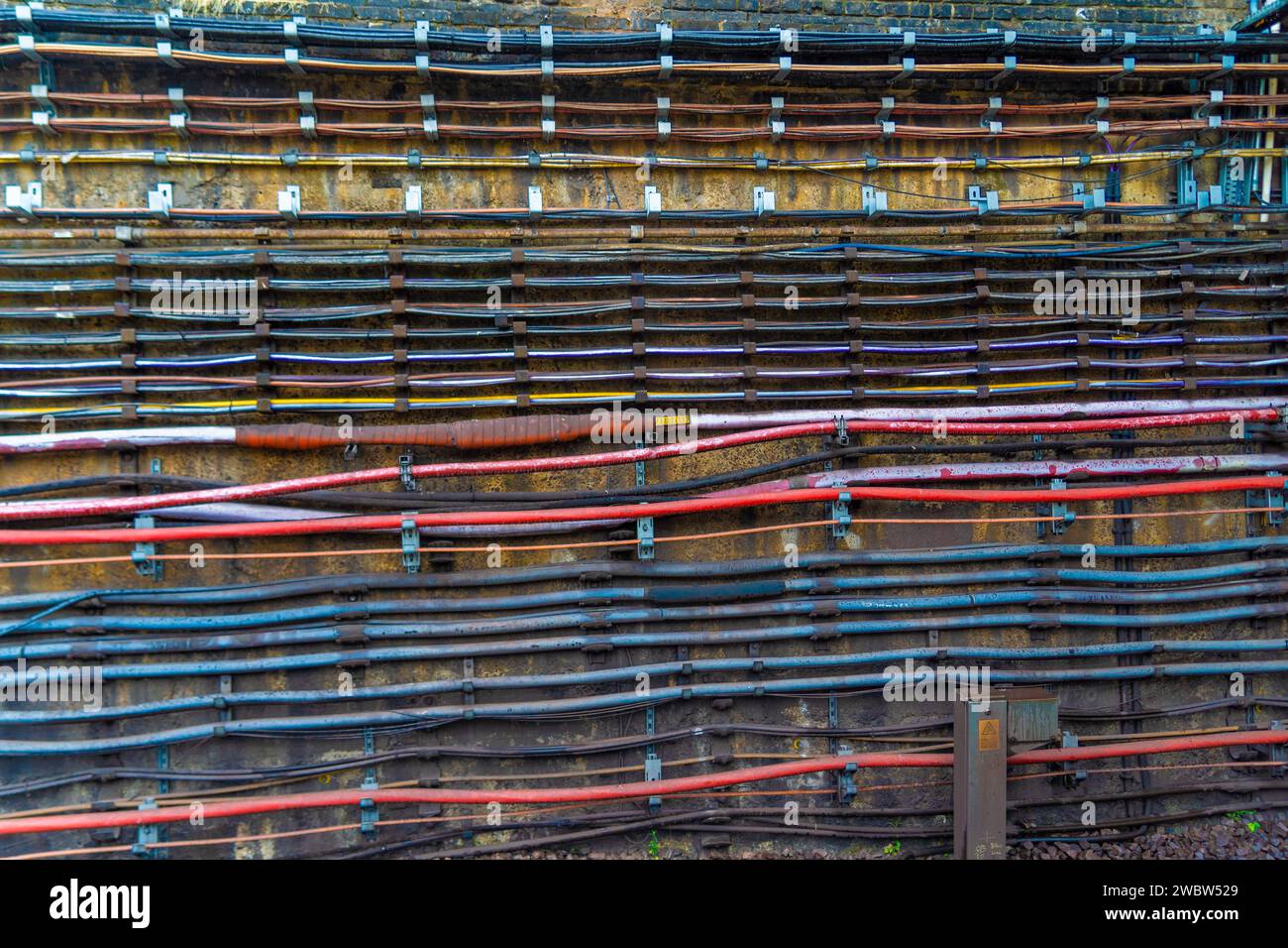 Wiring running along wall for technical wallpaper backgrop Stock Photo ...