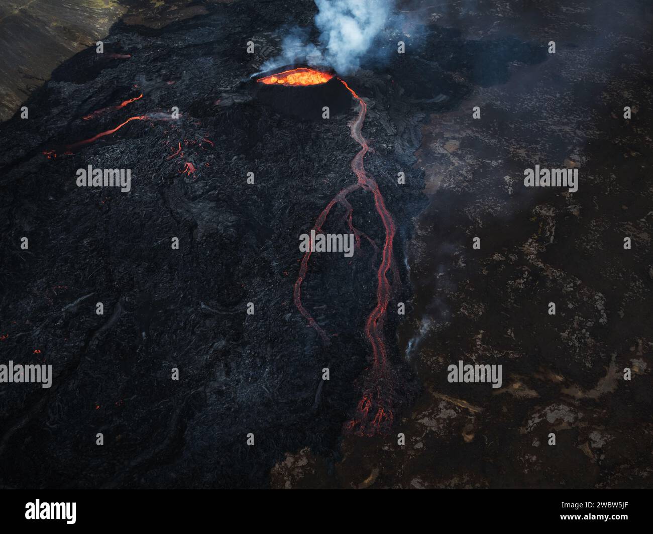 Unique view of the erupted volcano and surroundings, boiling red hot ...
