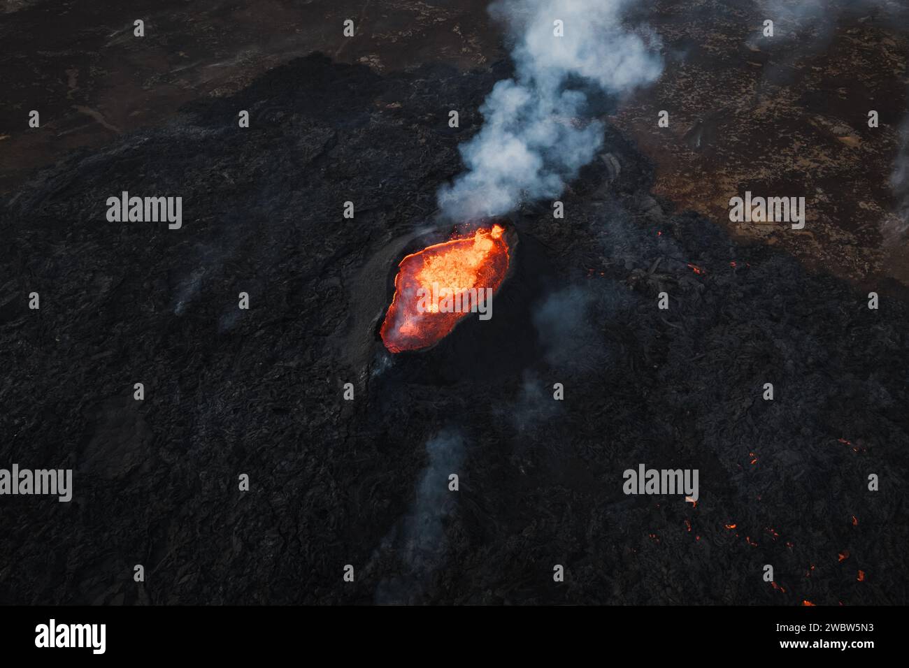 Unique view of the erupted volcano and surroundings, boiling red hot ...