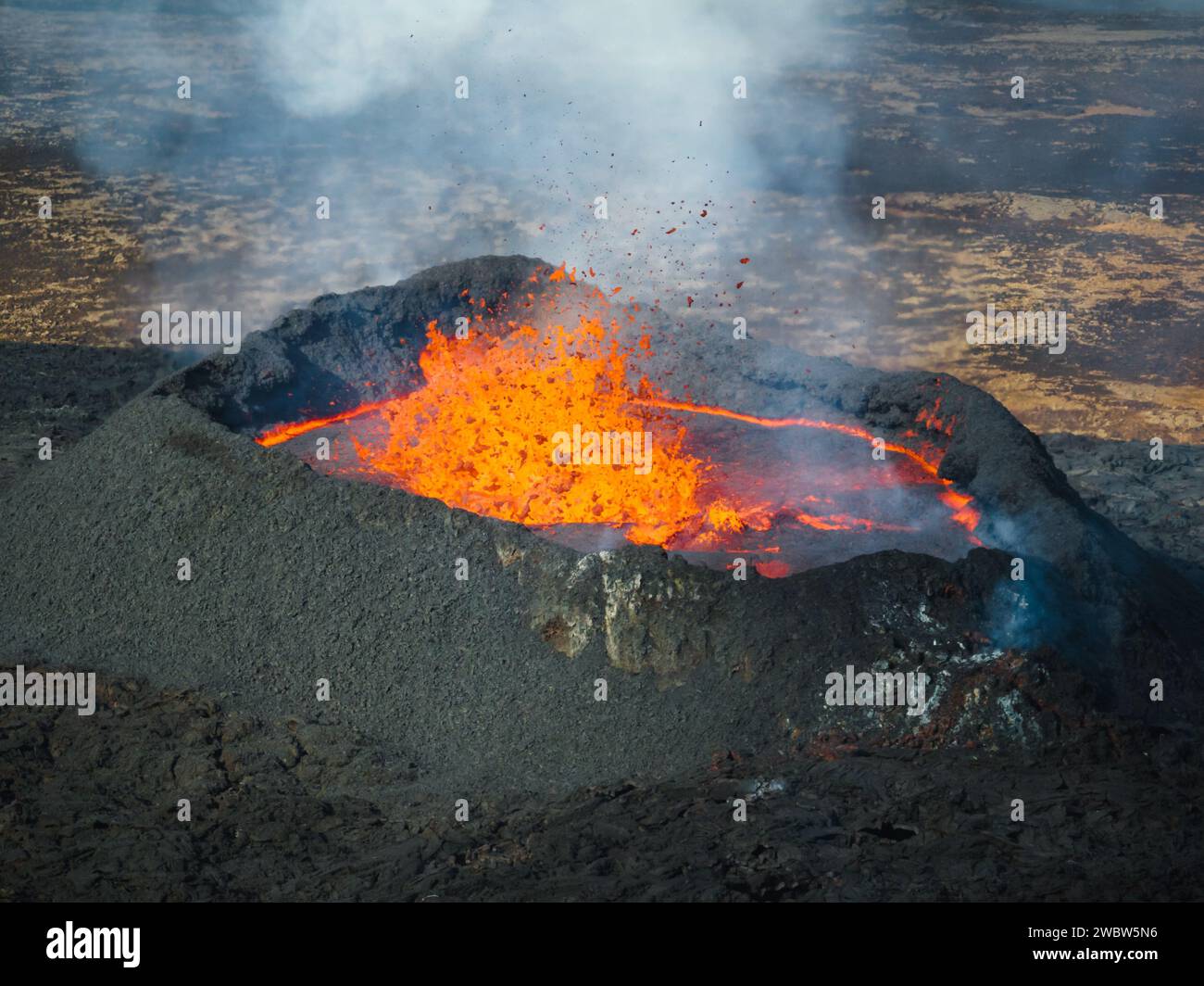 Unique view of the erupted volcano and surroundings, boiling red hot ...