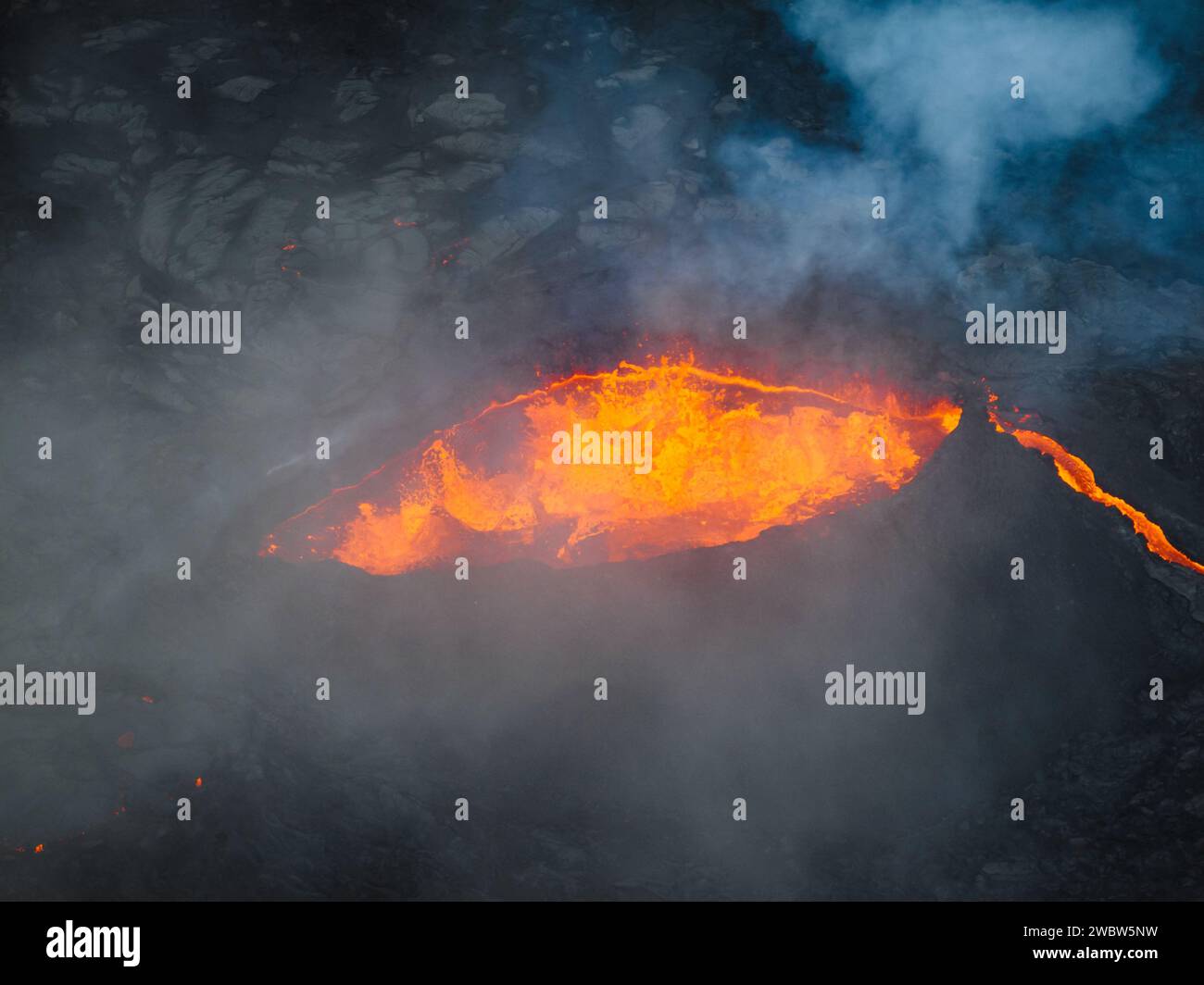 Unique view of the erupted volcano and surroundings, boiling red hot ...