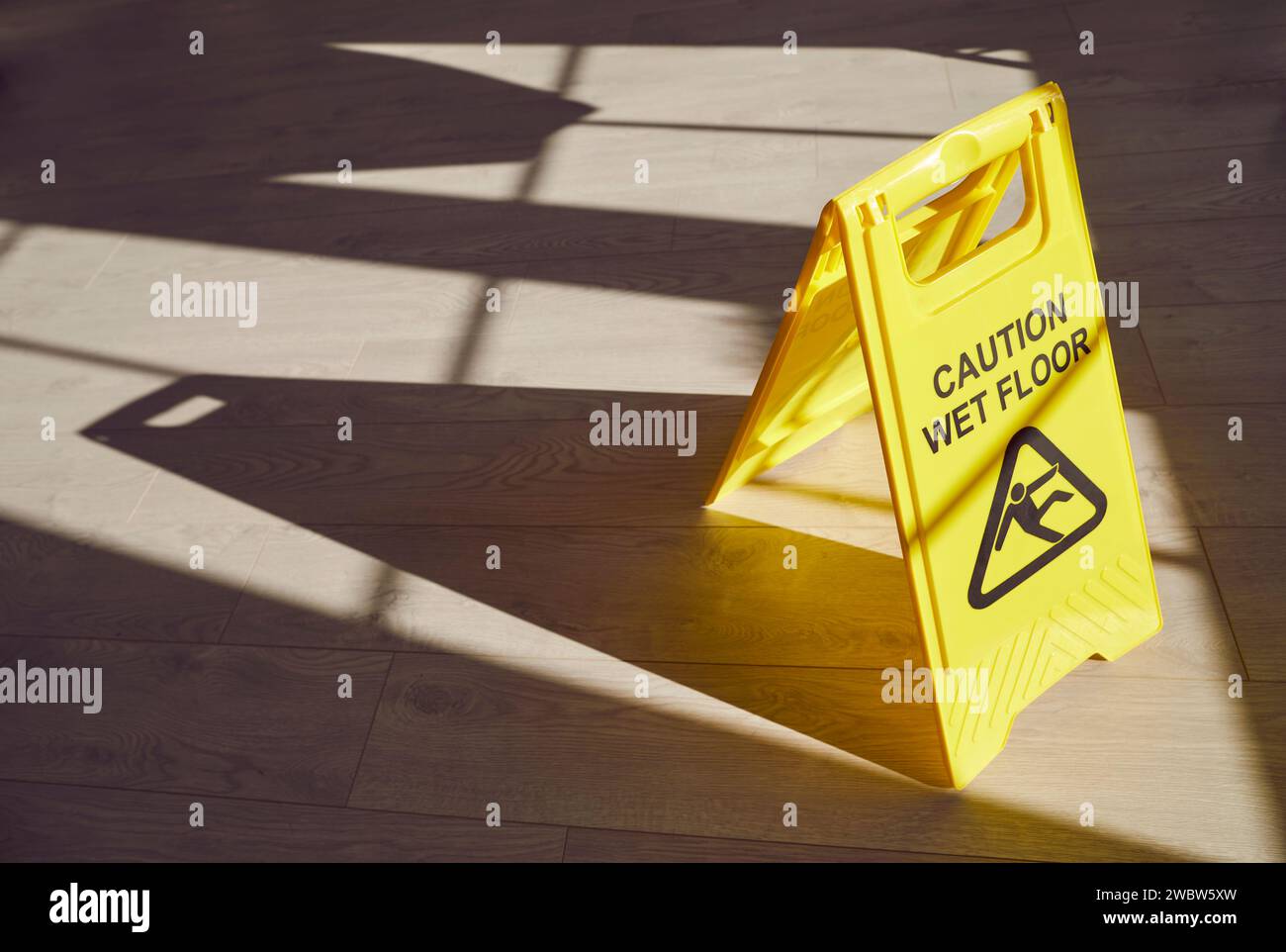 Yellow Wet Floor Sign for Slippery Surface Stock Photo - Alamy