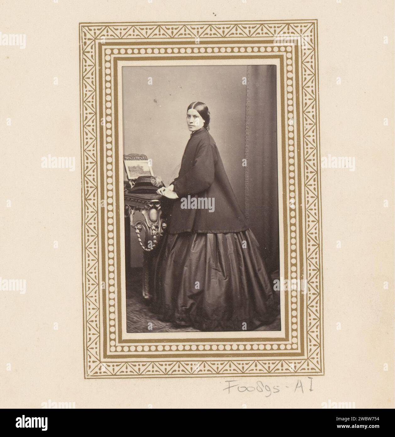 Portrait a standing woman at a table, G. and R. Lavis, 1867 - 1875 ...