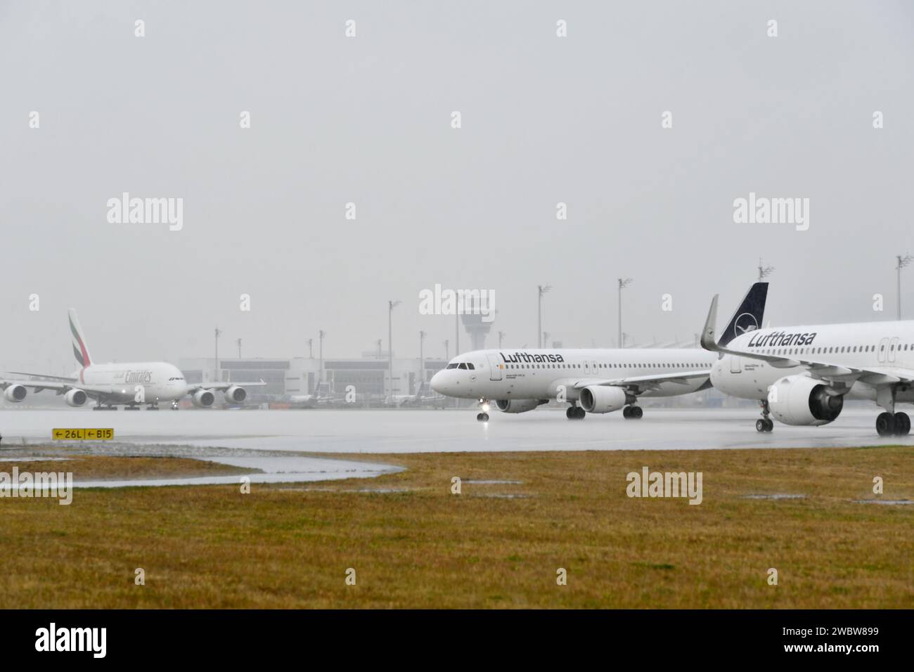 Lufthansa, Emirates, Aircraft, roll, taxiway, rain, wet, conditions ...