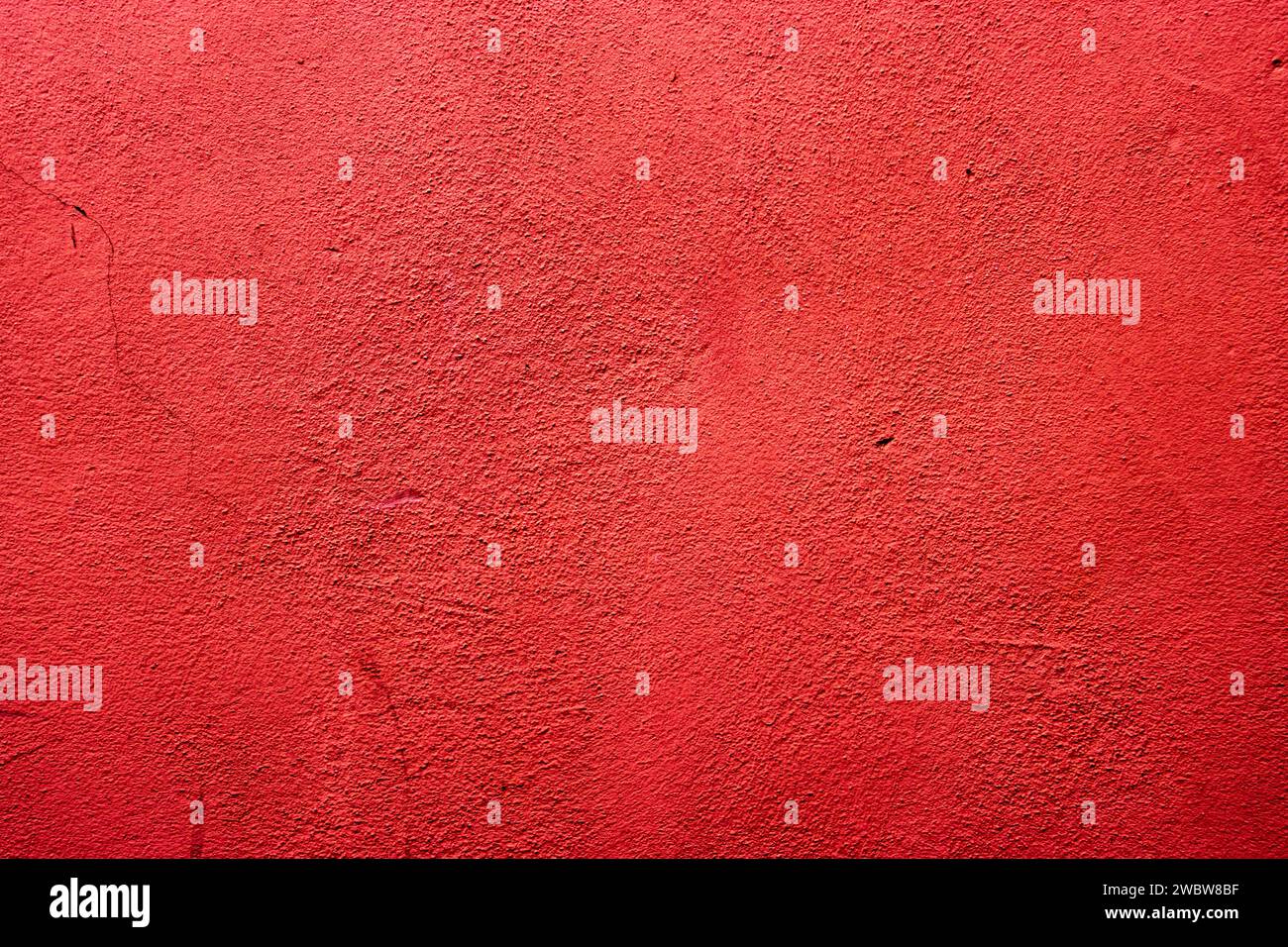 Bright red colored abstract wall background with textures of different ...