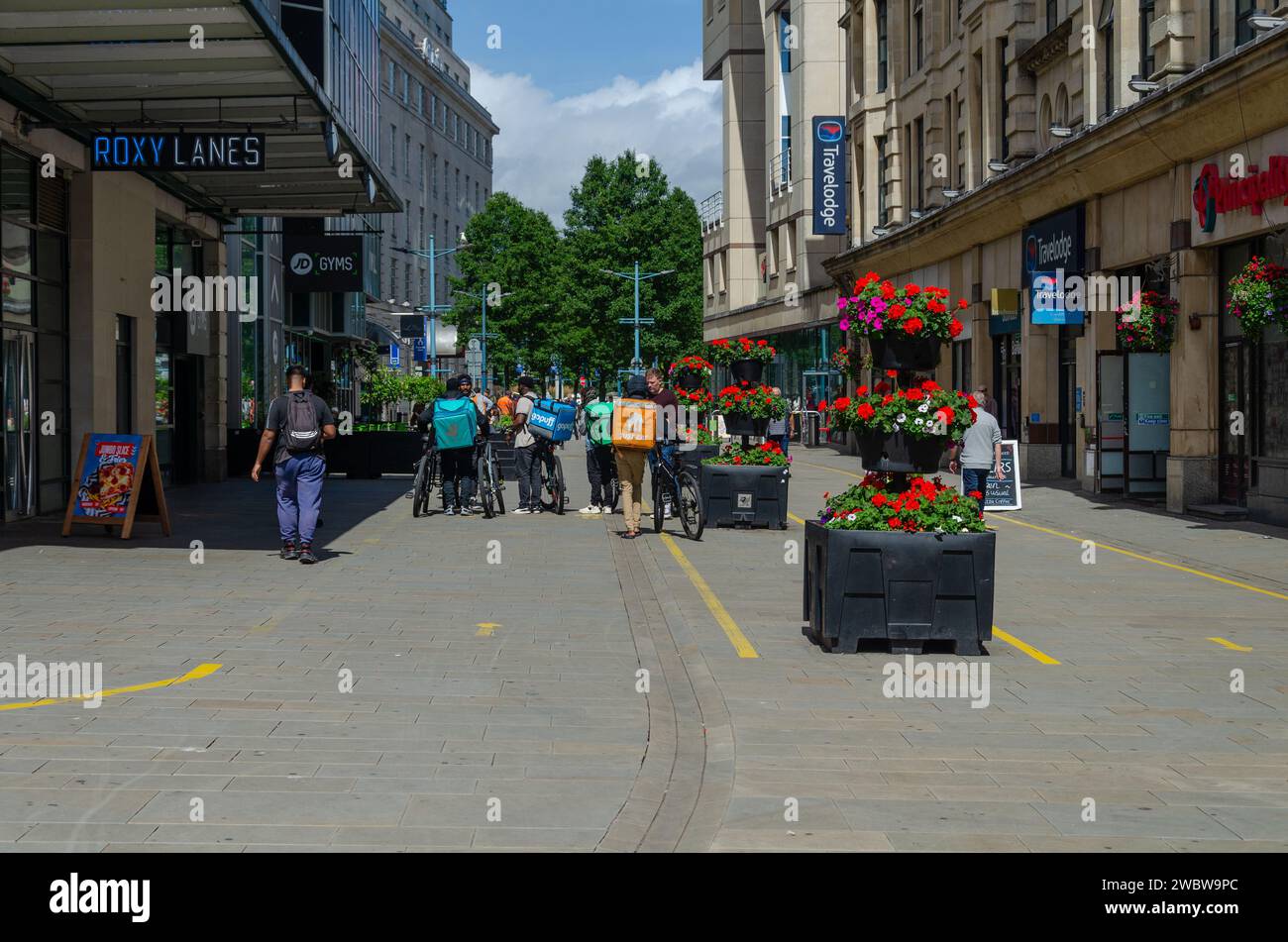 Cardiff, Glamorgan, Wales August 11 2023 - Delivery men on bikes ...