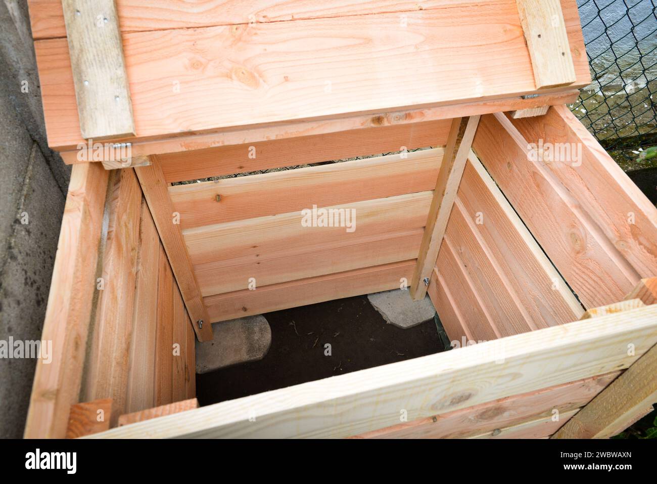 Top view on a new empty wooden compost bin, made with Douglas fir ...