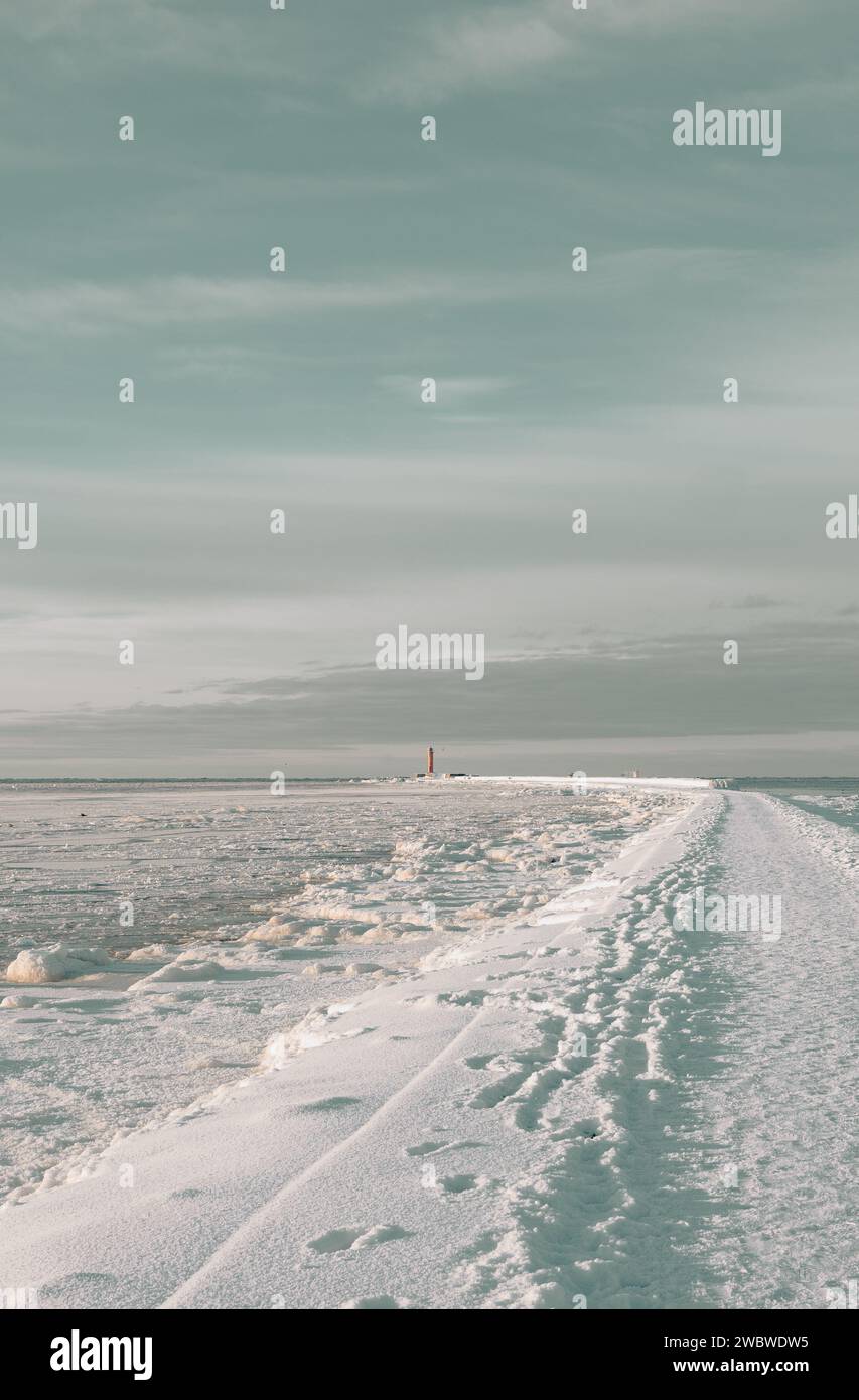 colorful winter landscape with frozen broken ice sea clody sky and red ...