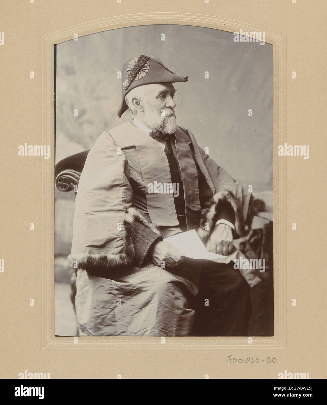 Portrait of a sitting man in gown with stitch and letter in hand ...