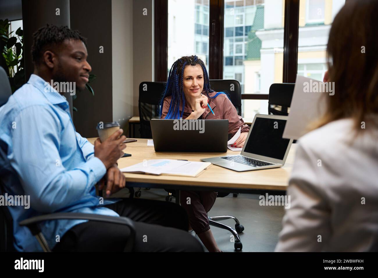 Team of creative adv managers working on logo or tagline creating Stock ...