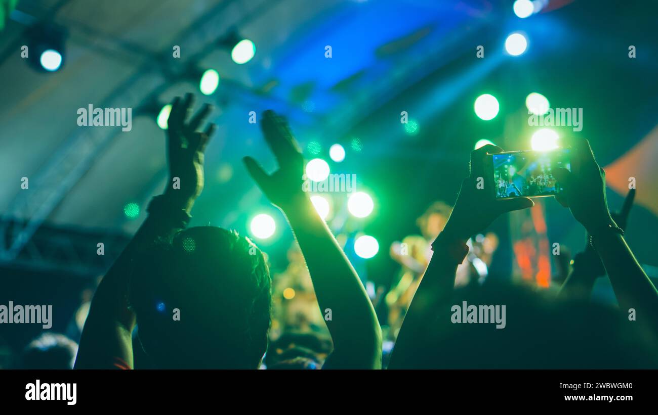 Person in focus in blurred crowd hi-res stock photography and images ...