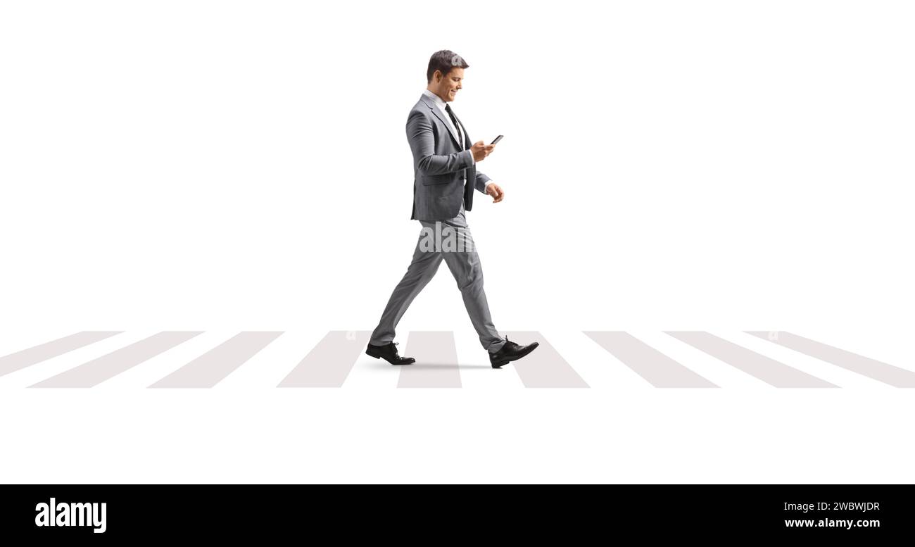 Full length profile shot of a professional man using a smartphone and ...