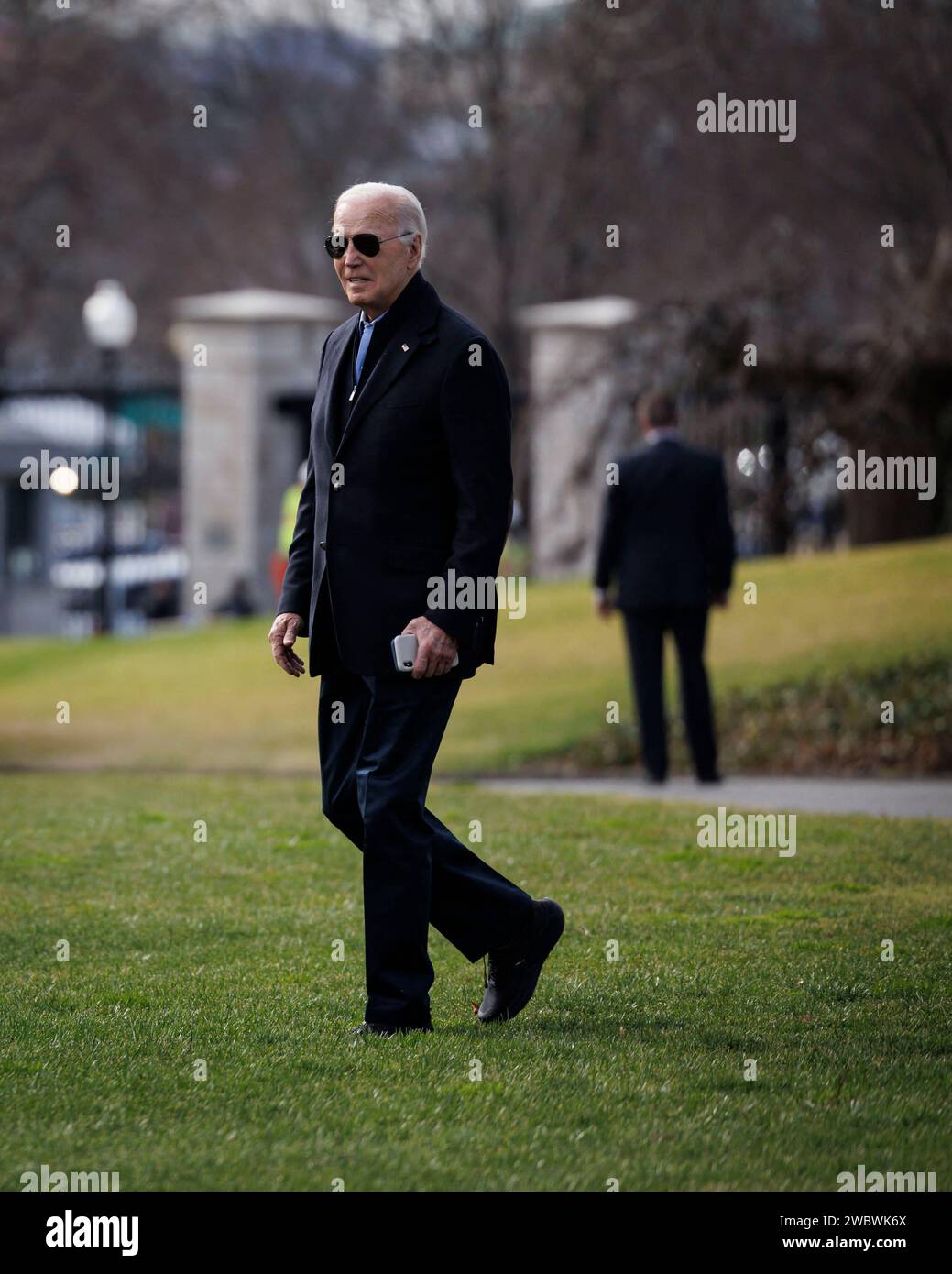 Washington, United States. 12th Jan, 2024. US President Joe Biden walks ...