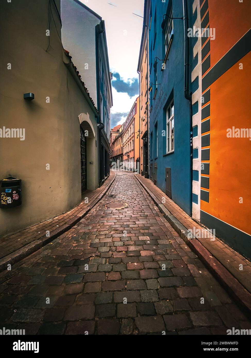 Vibrant buildings adorn a charming cobblestone street in Riga, Latvia ...