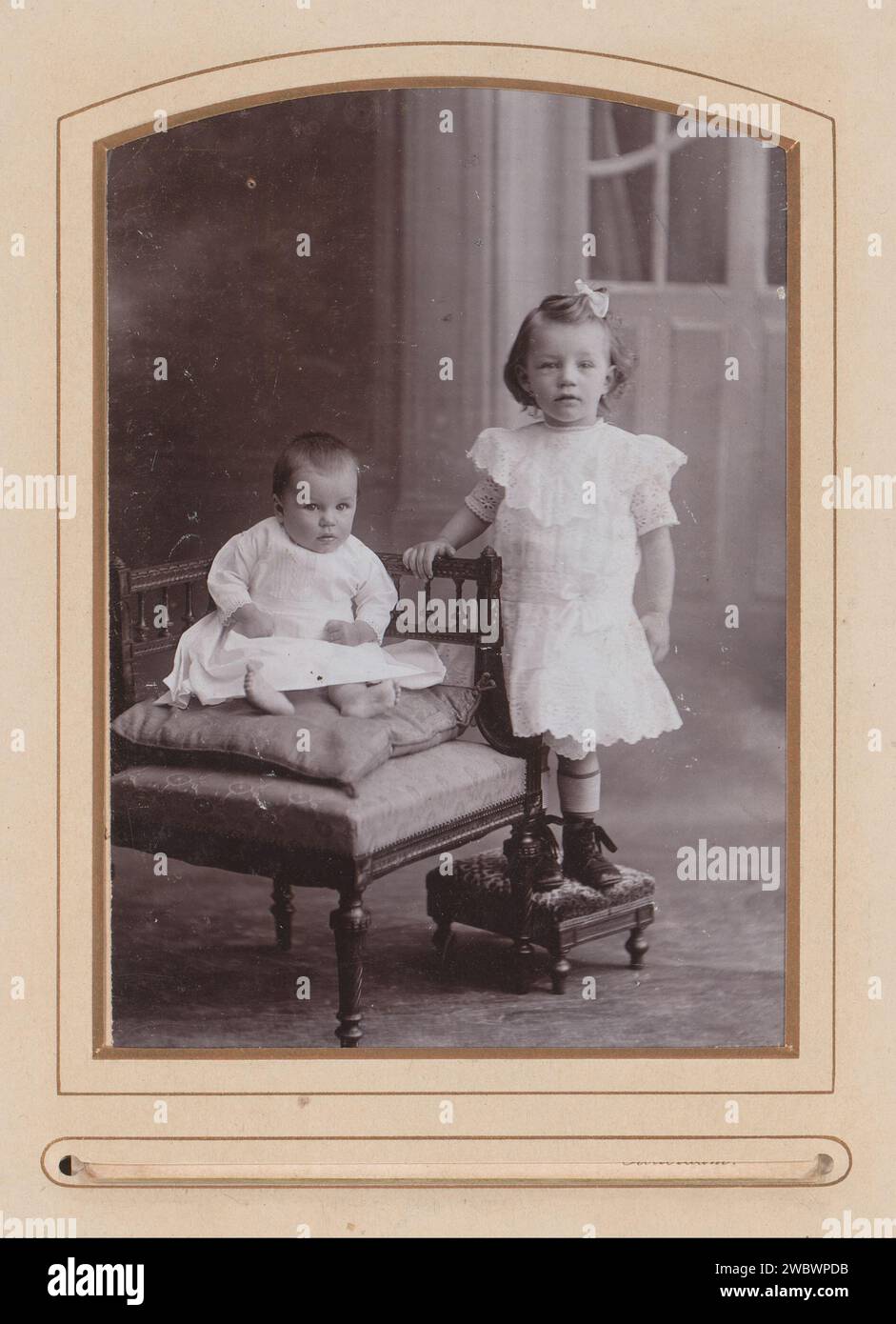 Portrait of a sitting baby and a standing girl, Cornelis Johannes ...
