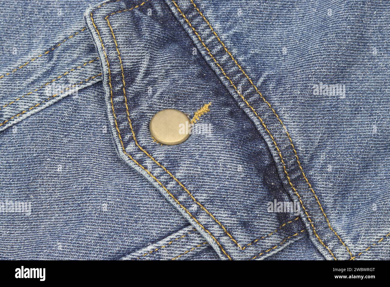 Classic jeans jacket pocket button close-up Stock Photo - Alamy